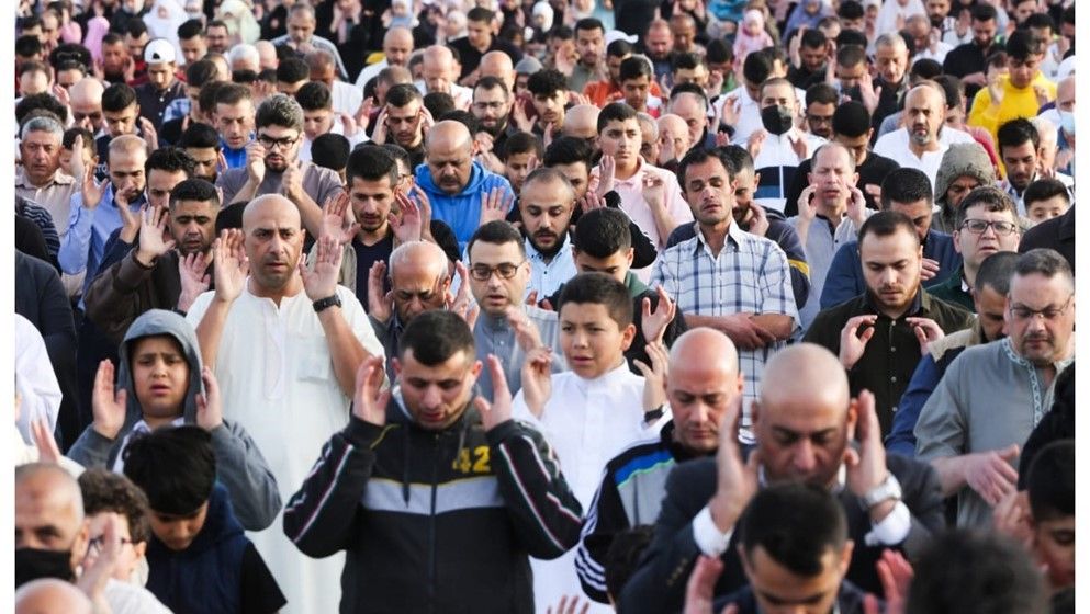 Jordanians perform Eid prayers...