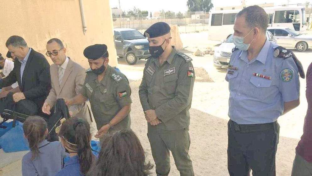 Police hand out school supplies...